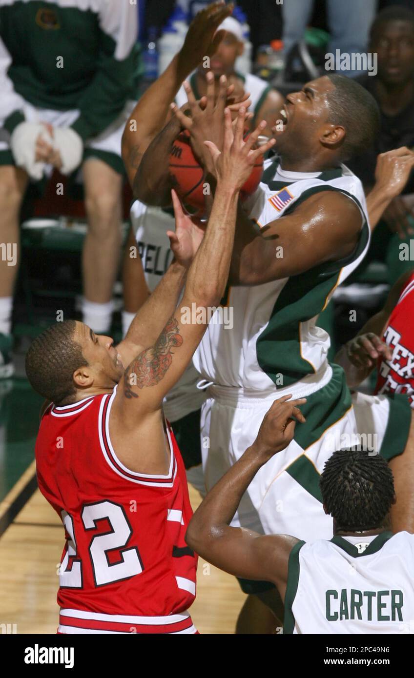 Baylor forward Tim Bush, center, works for a rebound in front of Texas ...
