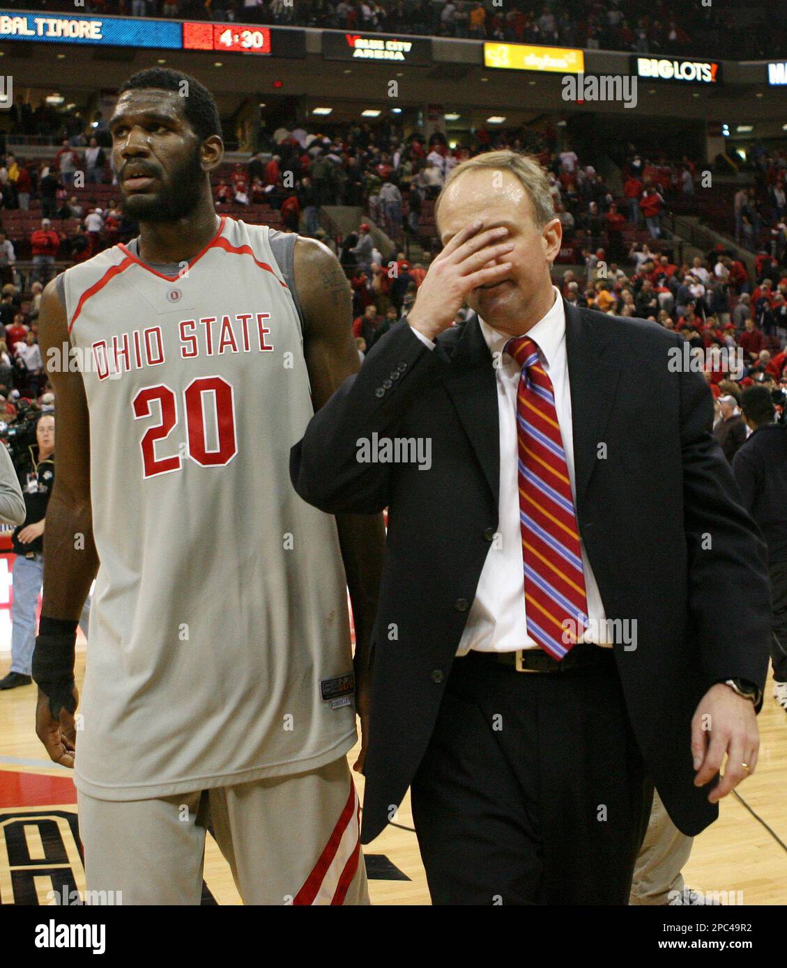 Ohio State coach Thad Matta, right, reacts as he walks off the court ...