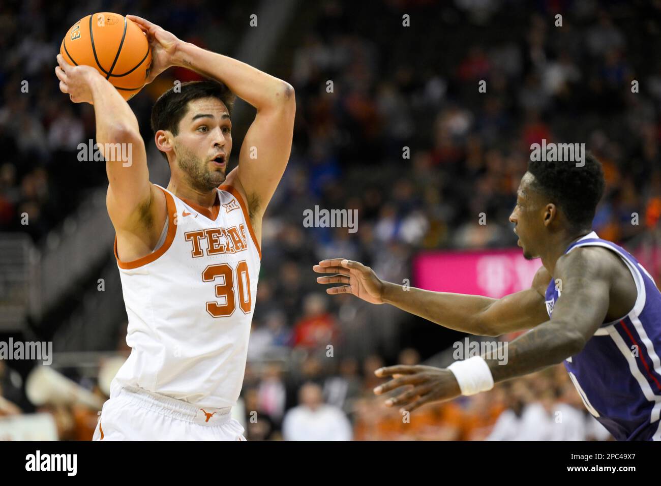 Texas forward Brock Cunningham (30) is guarded by TCU guard Damion ...