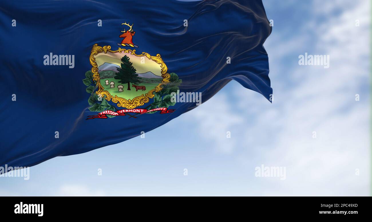 The Vermont state flag fluttering in the wind on a clear day. Coat of ...