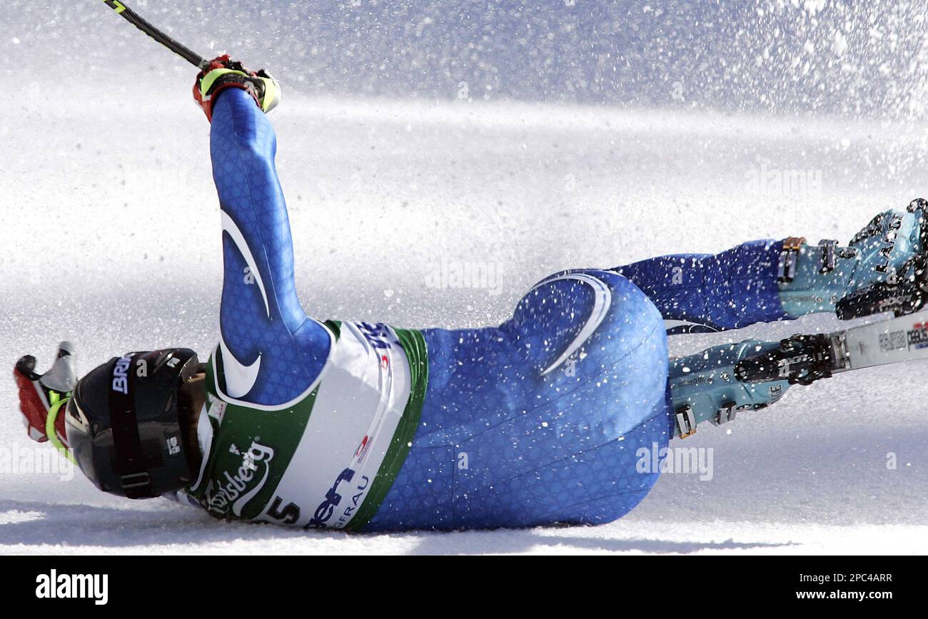 Italy's Peter Fill slides across the finish line on his way to take ...