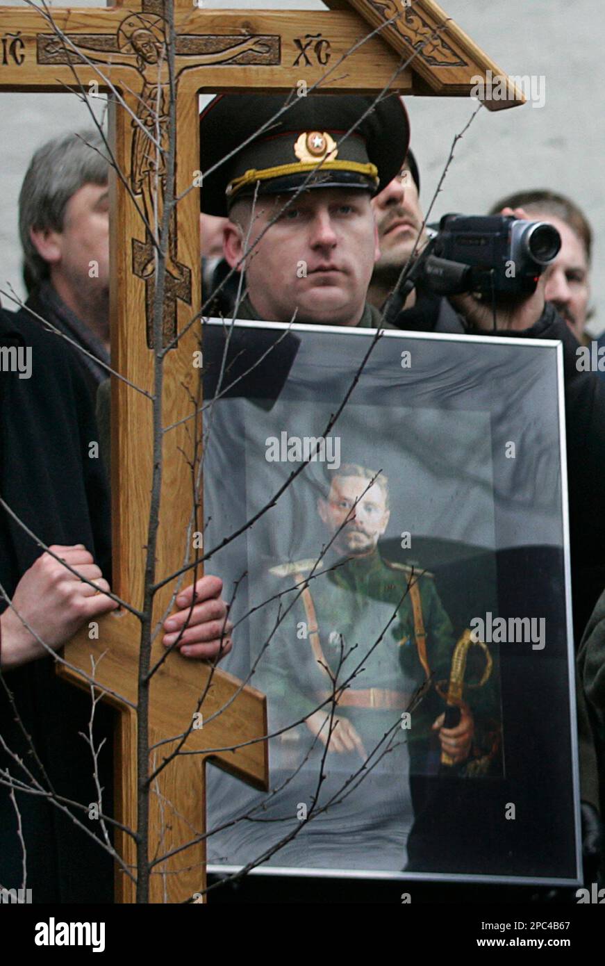 A mourner holds a portrait of White Army General Vladimir Kappel during ...