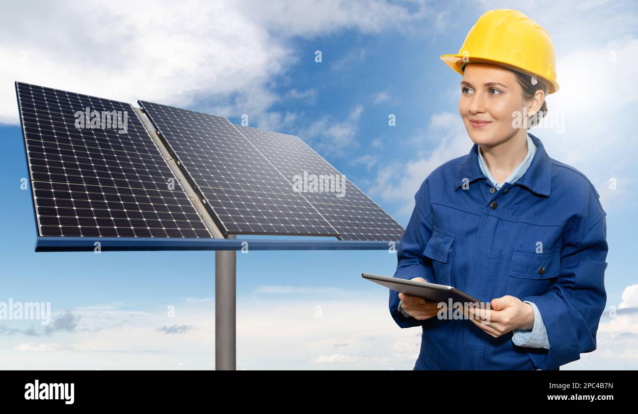 Woman engineer with tablet computer on a background of wind turbines ...