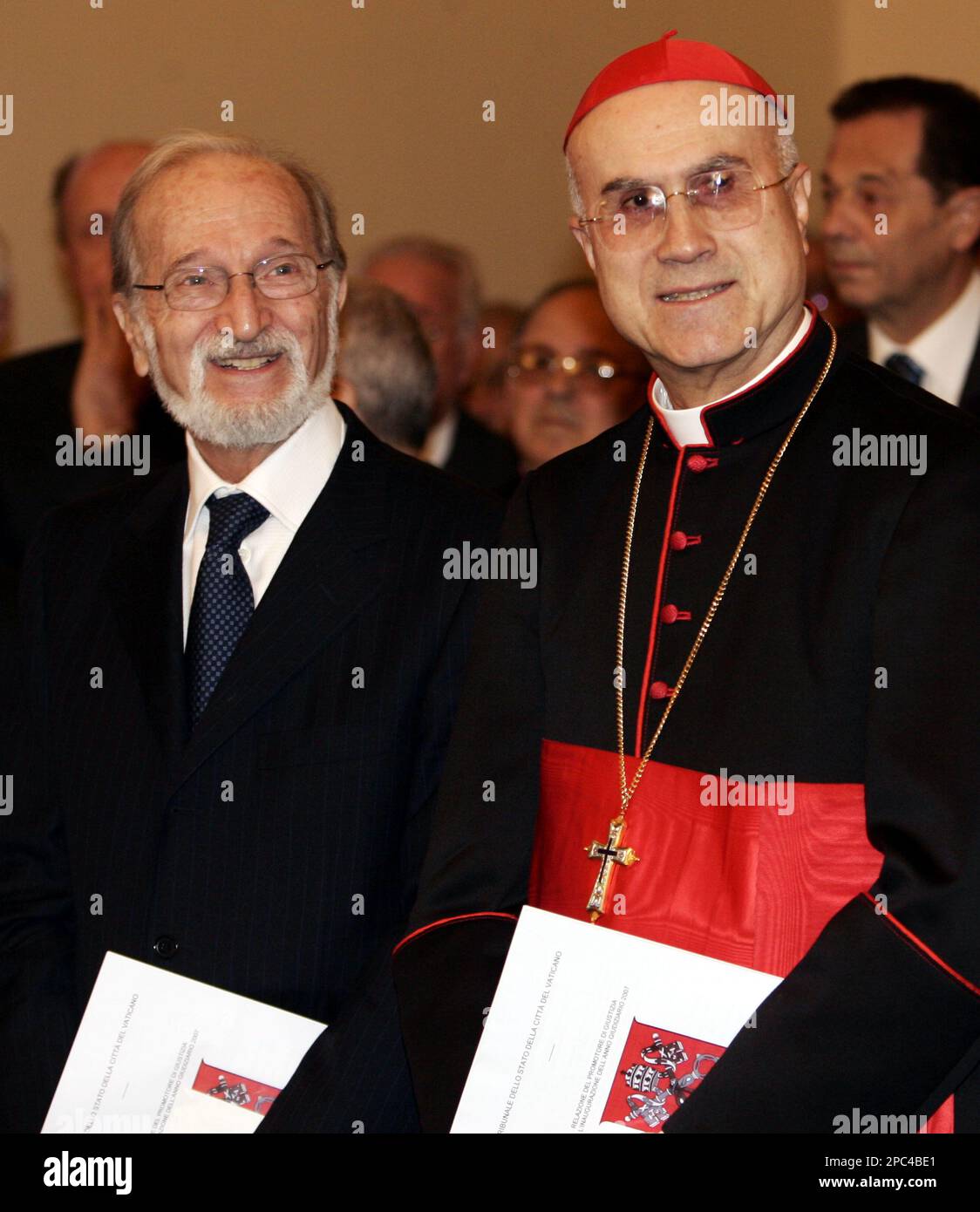 Vatican Secretary of State Tarcisio Bertone, right, and Italian ...
