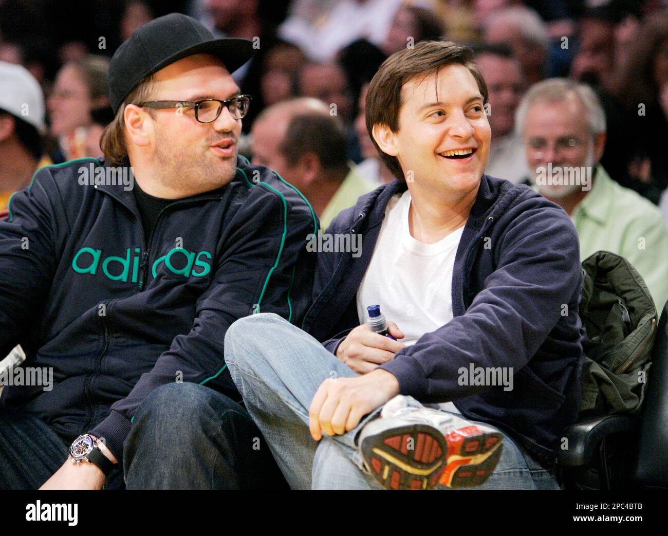 Actors Ethan Suplee, left, and Tobey Maguire watch the Los Angeles ...