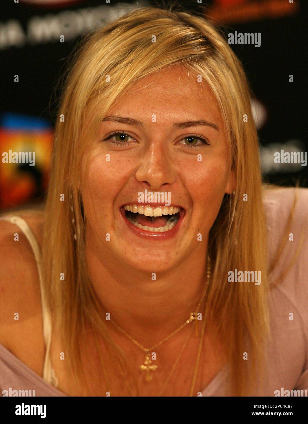 Russia's Maria Sharapova, top seed, is all smile during a press ...