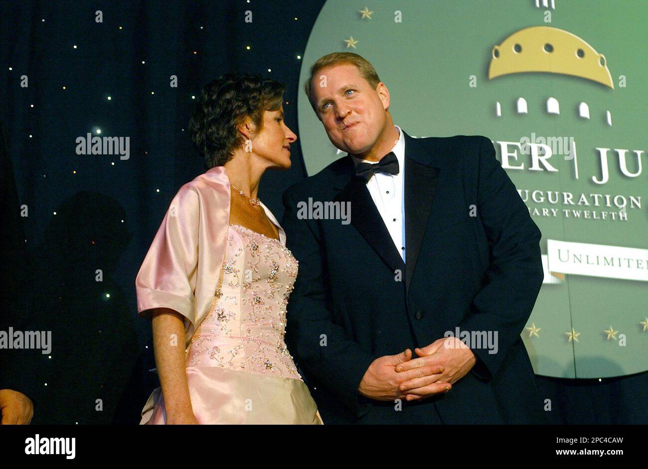 Iowa Gov. Chet Culver and his wife Mari Culver talk as they wait to be ...