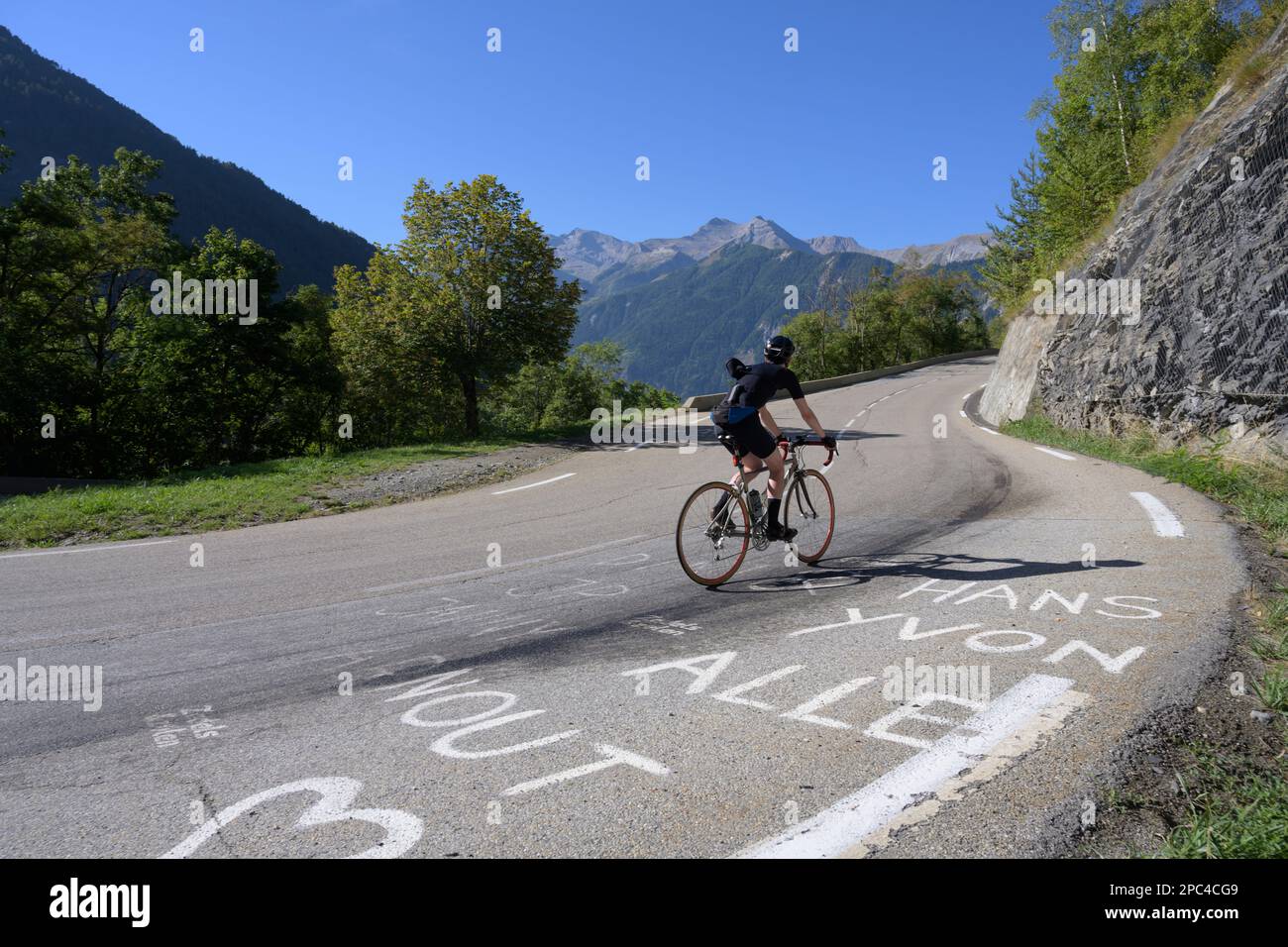 Male road cyclist climbing Alpe D'Huez, French Alps, September 2022 ...