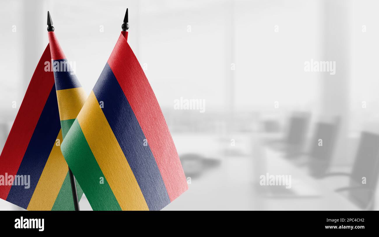 Small flags of the Mauritius on an abstract blurry background Stock ...