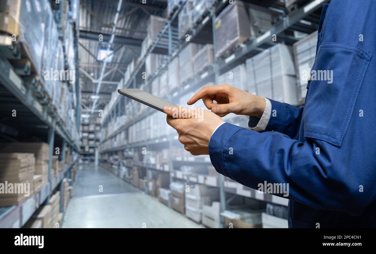 Warehouse manager with digital tablet Stock Photo - Alamy