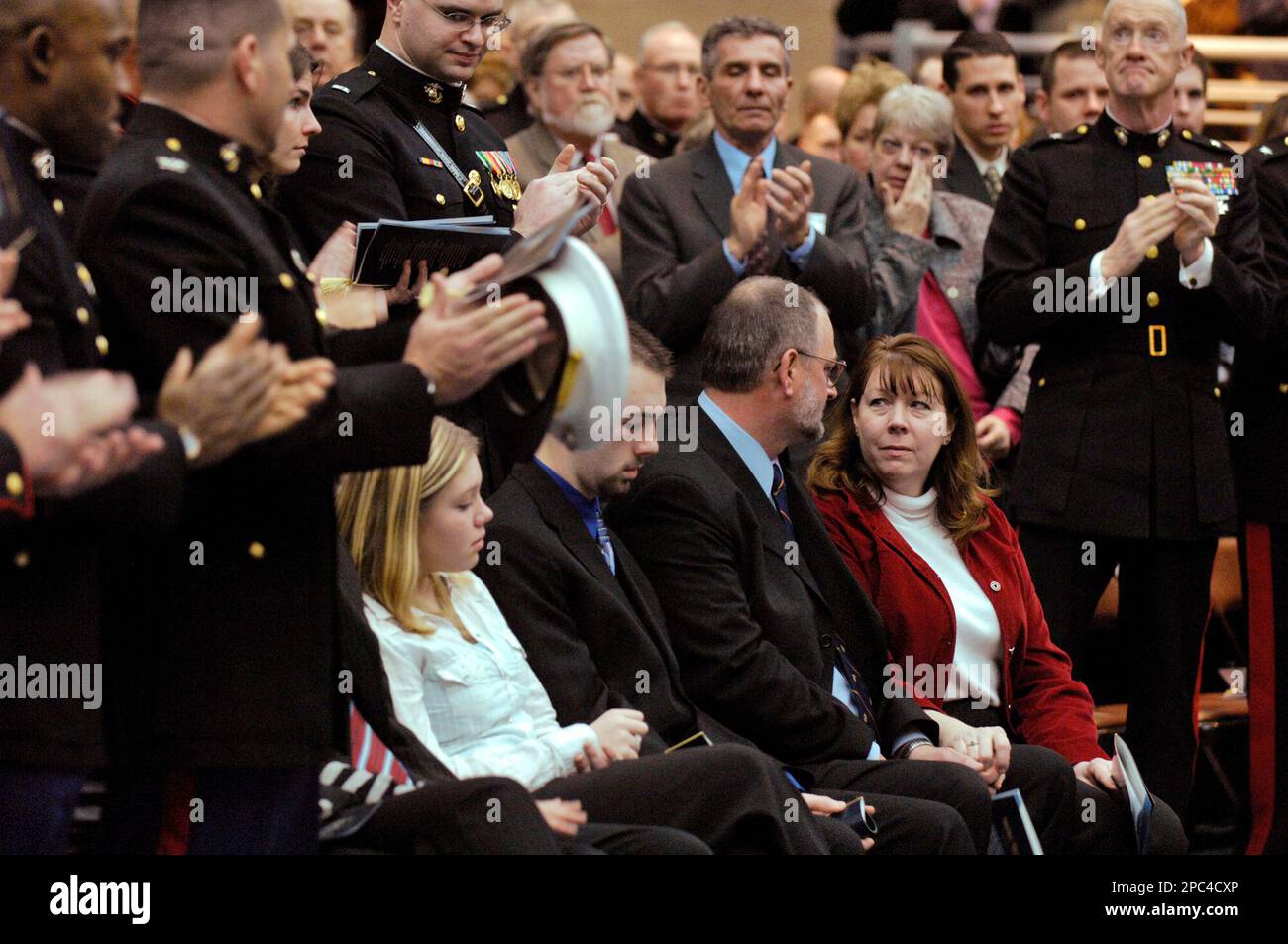 The family of Cpl. Jason Dunham is given a standing ovation during a ...