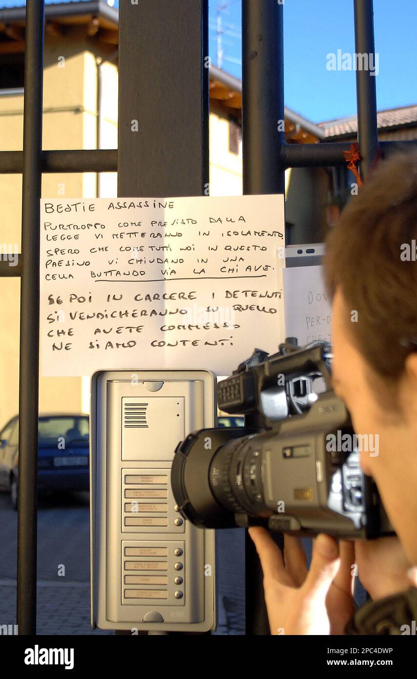 An unidentiified cameraman shoots a buzzer with a sign, Friday Jan. 12 ...