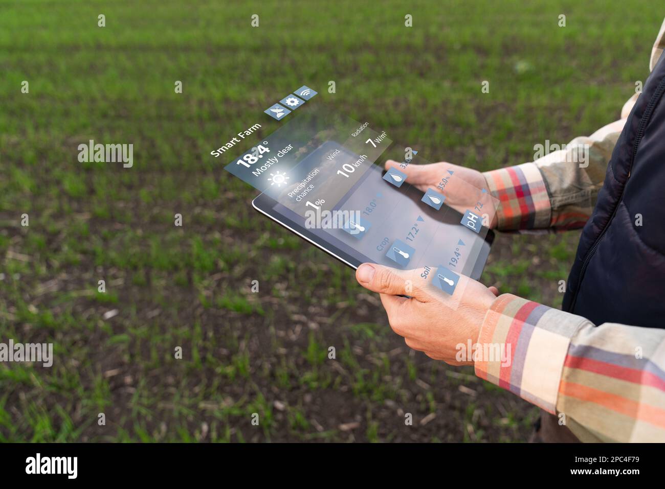 Farmer with digital tablet on an agricultural field. Smart farming and ...