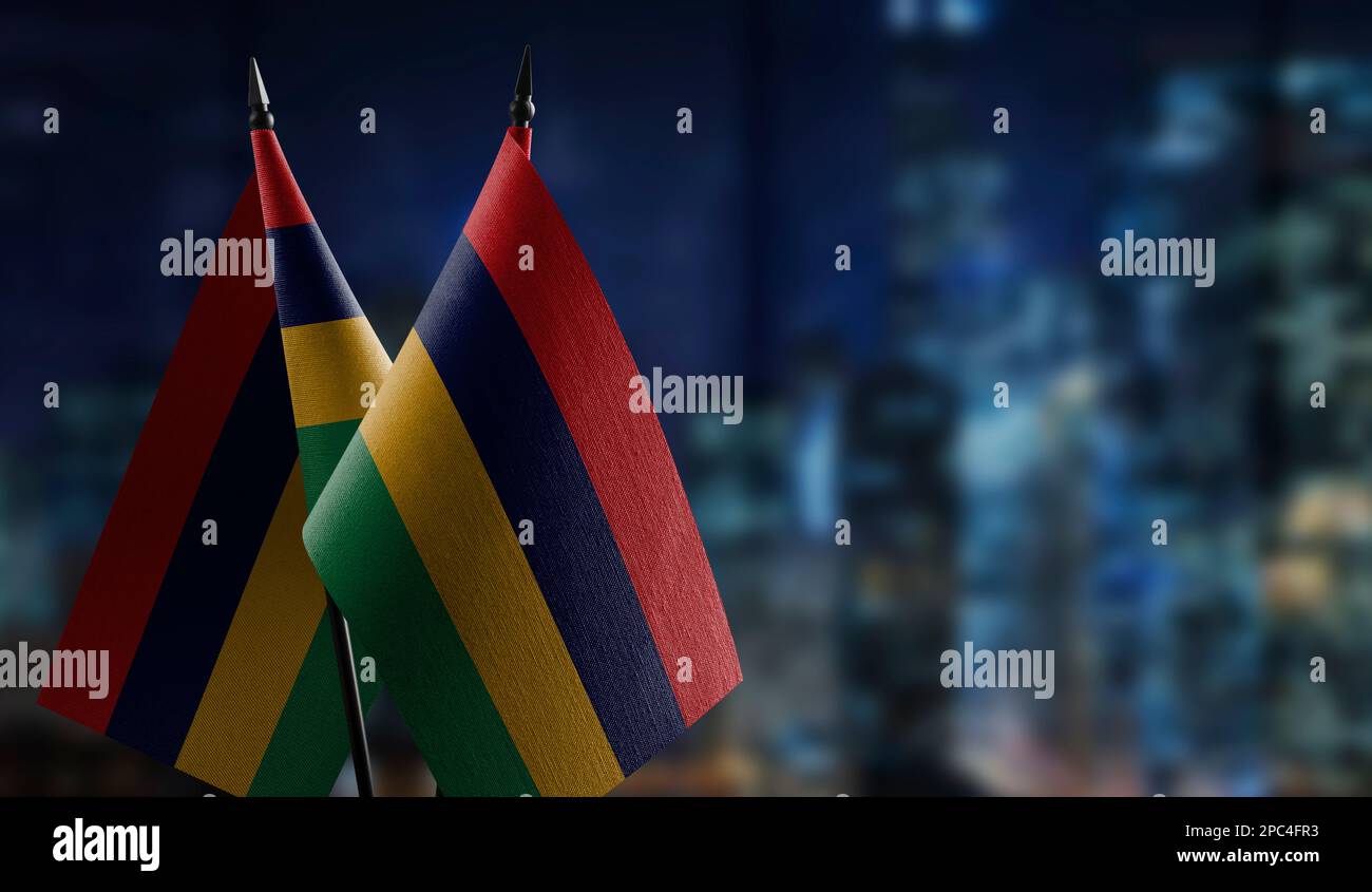Small flags of the Mauritius on an abstract blurry background Stock ...