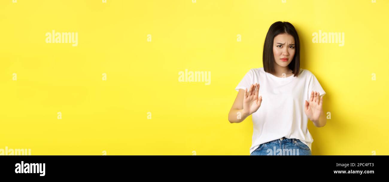 Please no. Asian woman, victim of assualt or domestic abuse, pleading ...