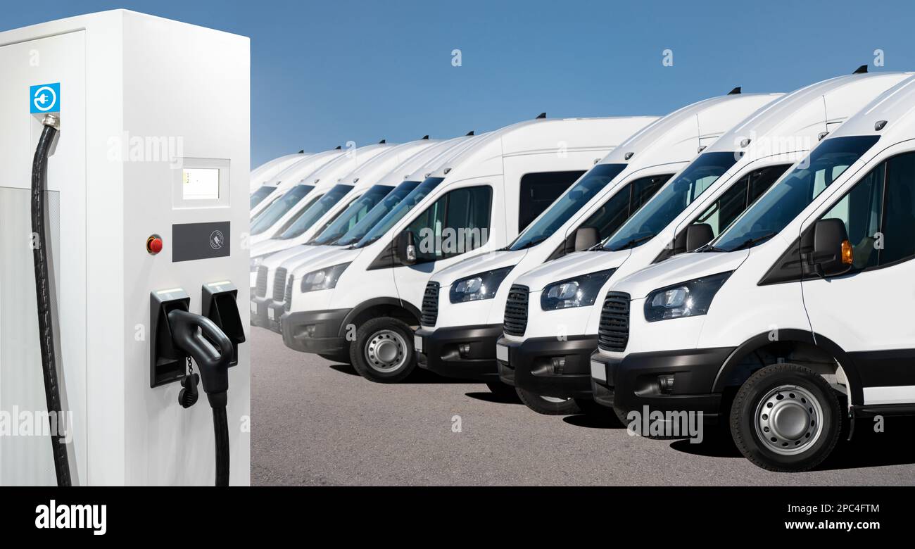 Electric vehicles charging station on a background of a vans. Concept ...