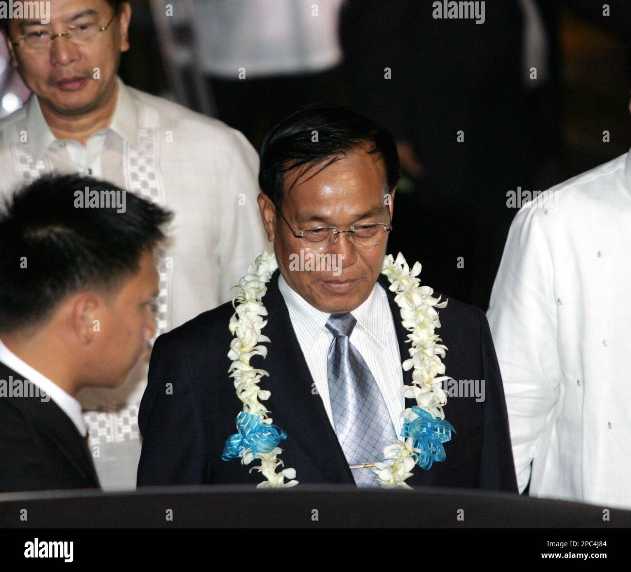 Myanmar Prime Minister Gen. Soe Win, center, is escorted to his ...