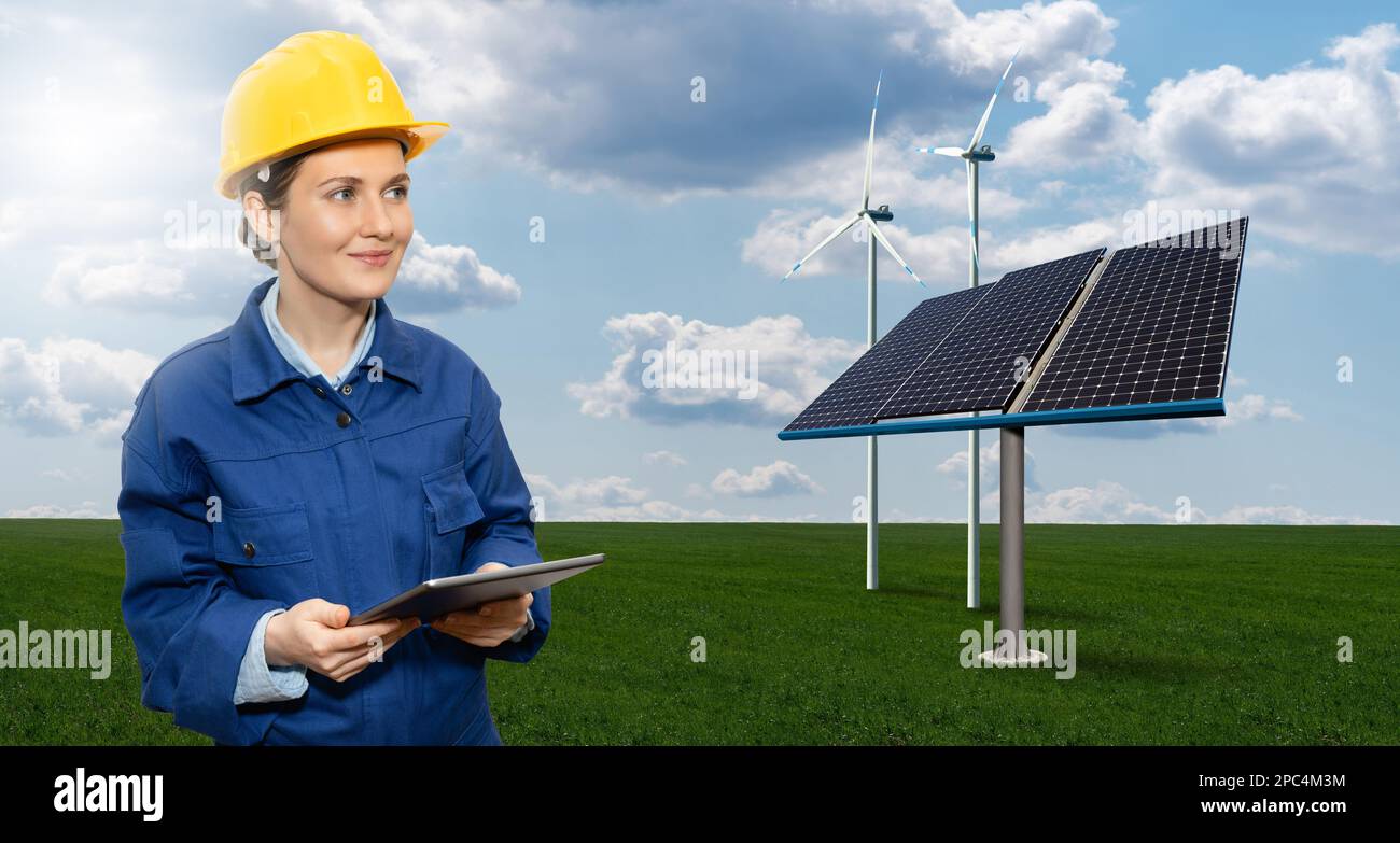 Woman engineer with tablet computer on a background of wind turbines ...