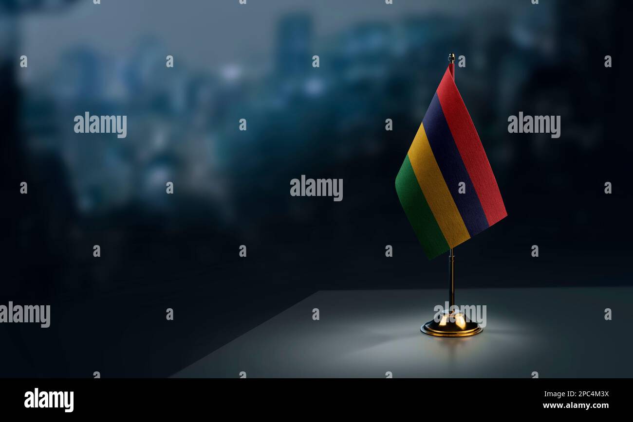 Small flags of the Mauritius on an abstract blurry background Stock ...