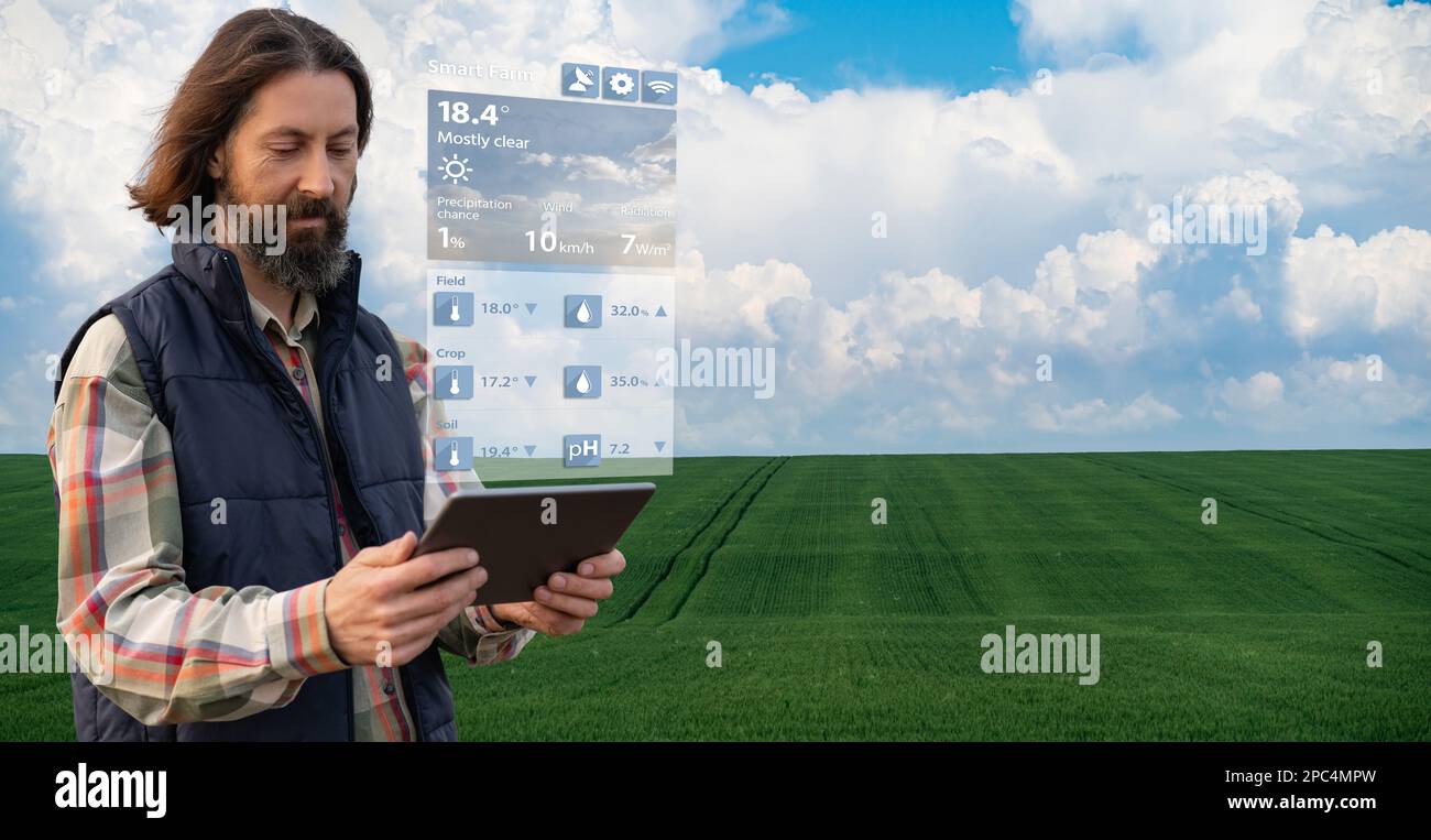 Farmer with digital tablet on an agricultural field. Smart farming and ...