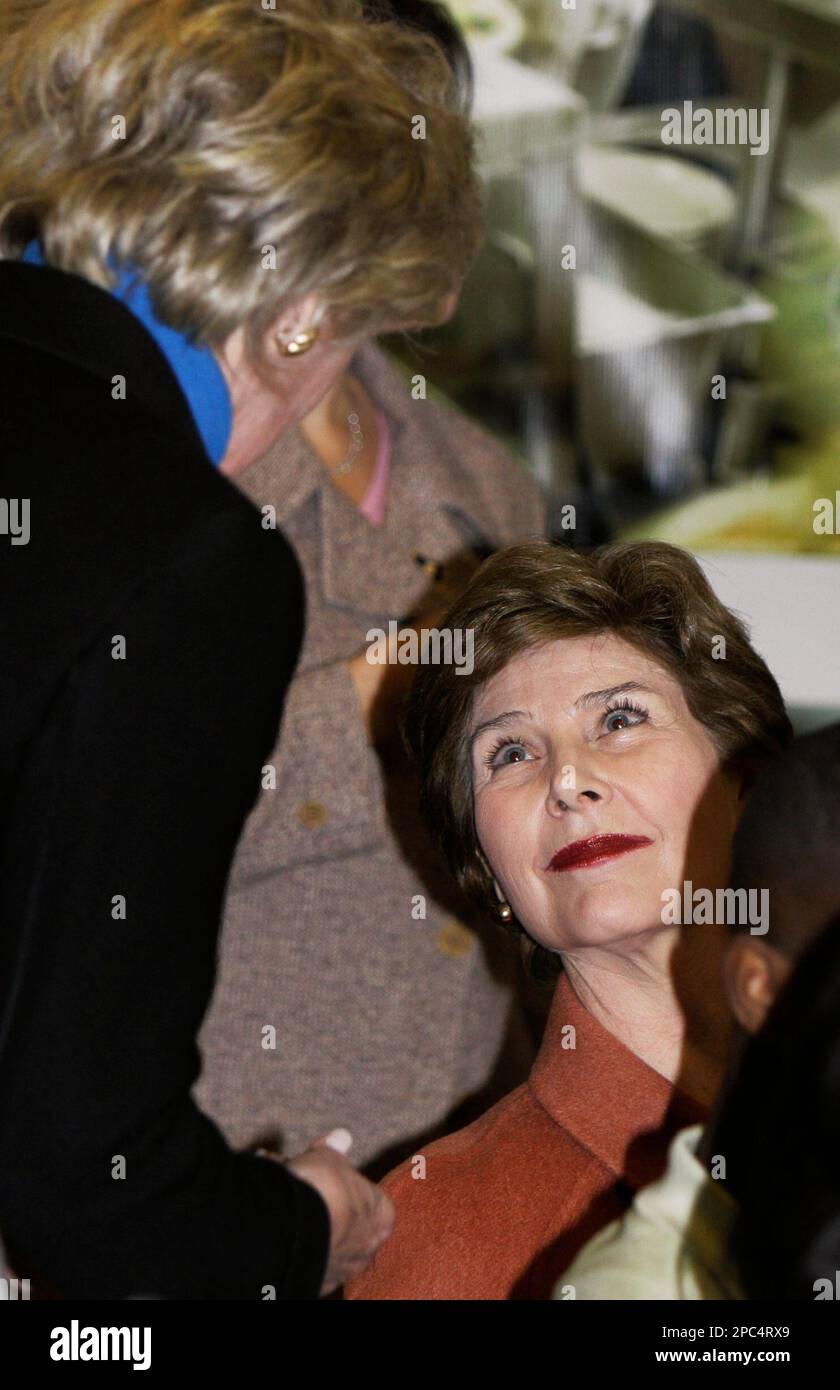 First lady Laura Bush talks with Anne Milling, left, before lunch at ...