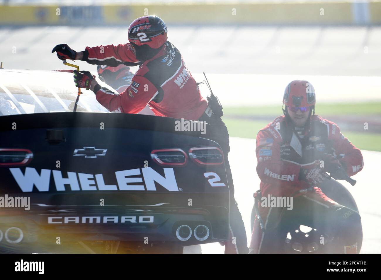 LAS VEGAS, NV - MARCH 04: A crew member adjusts the wedge on the car of ...