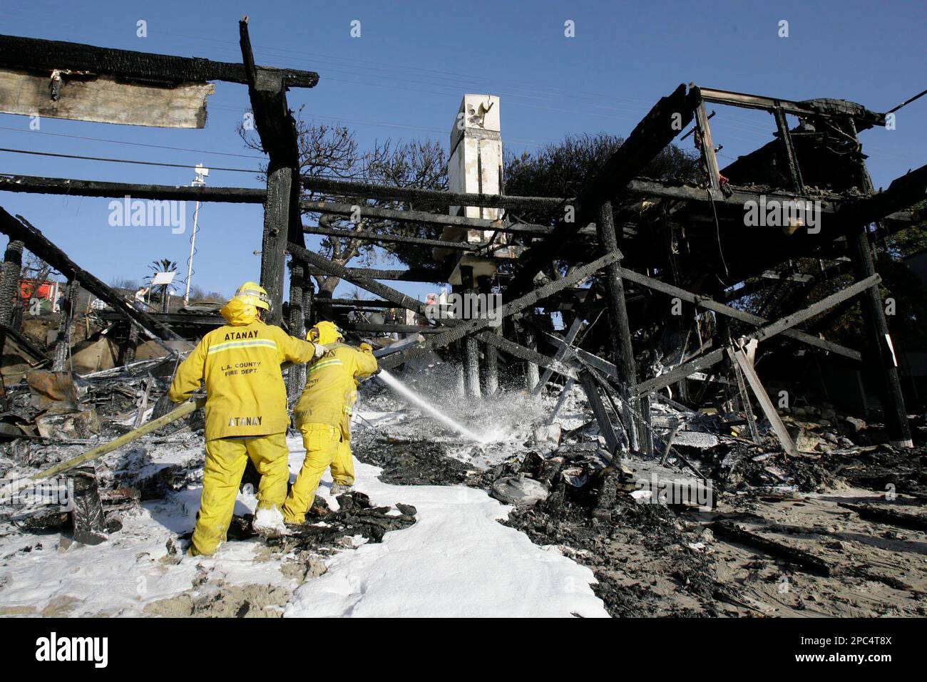 Los Angeles County firefighters Randy Atanay, left, and Robert Reardon ...