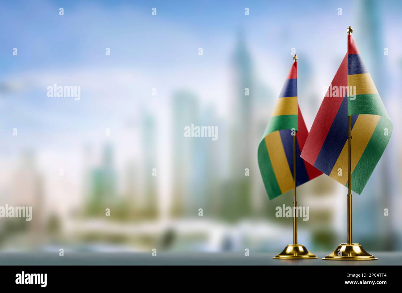 Small flags of the Mauritius on an abstract blurry background Stock ...