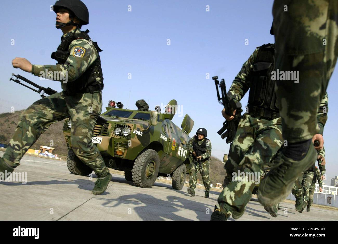 Chinese paramilitary officers during an anti-terrorism drill in ...