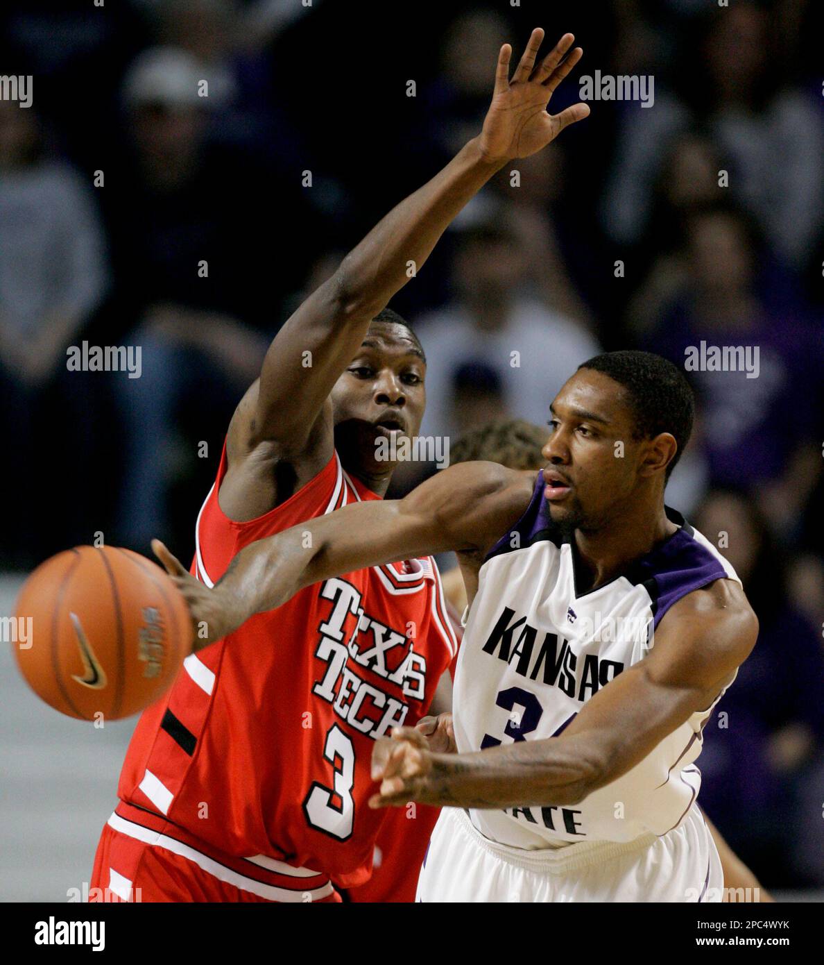Kansas State guard Akeem Wright, right, passes the ball while being pressured by Texas Tech ...