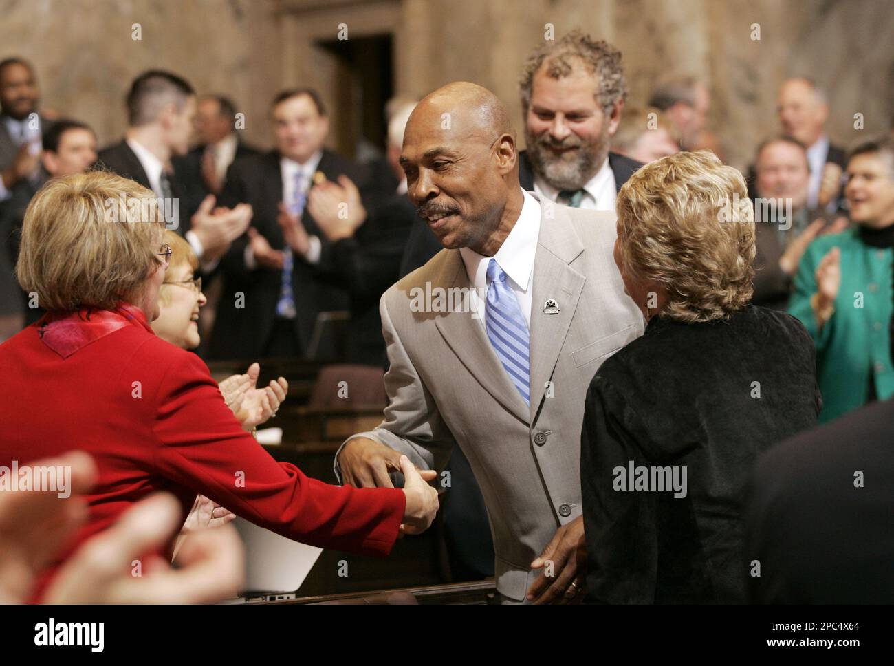 Democratic House Speaker Pro Tempore John Lovick is greeted as he makes ...