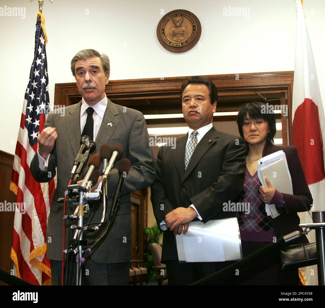 Commerce Secretary Carlos Guitierrez, left, and Japanese Trade Minister ...