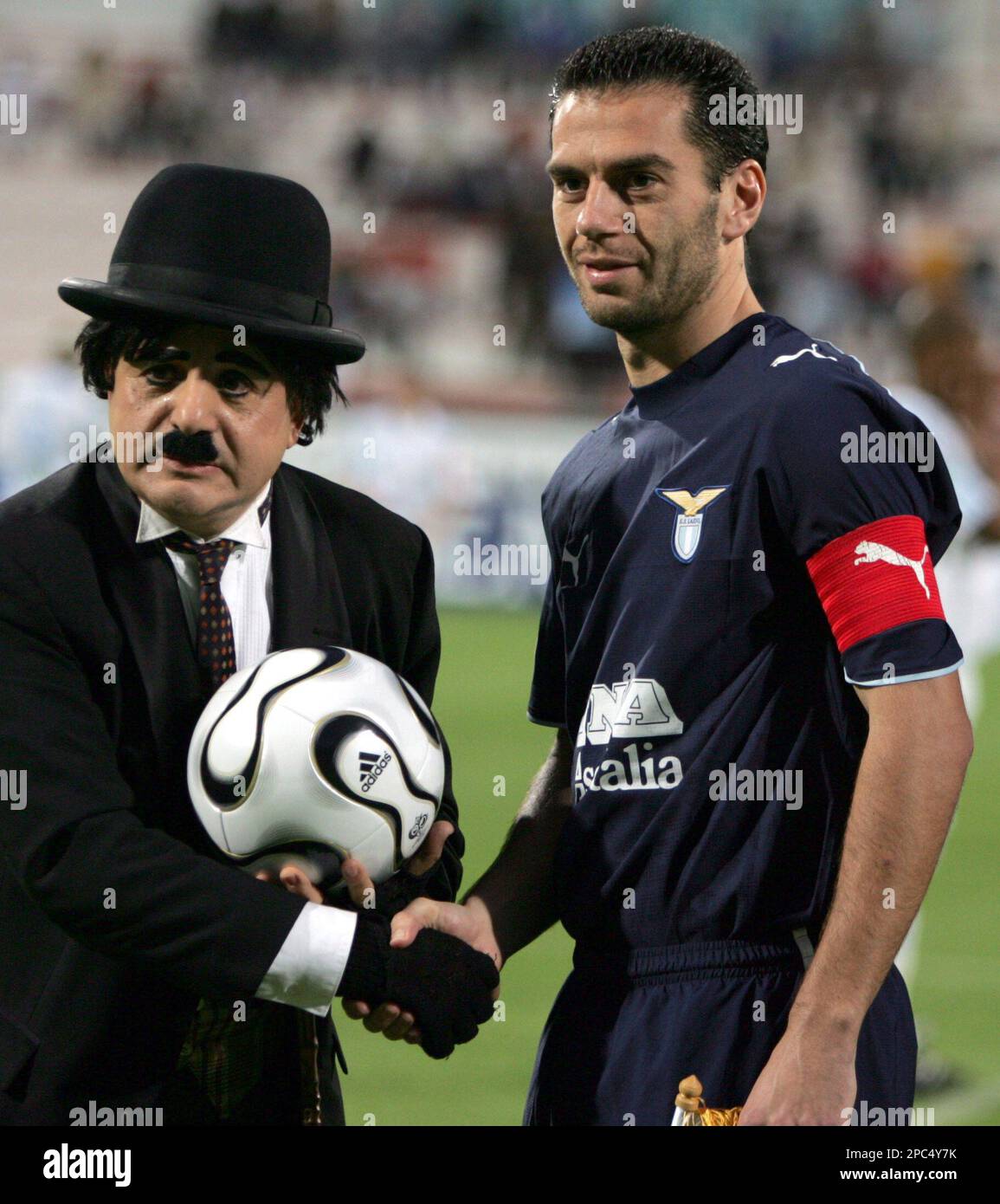 Lazio's captain, Luciano Zauri, right, shakes hands with a Charlie ...