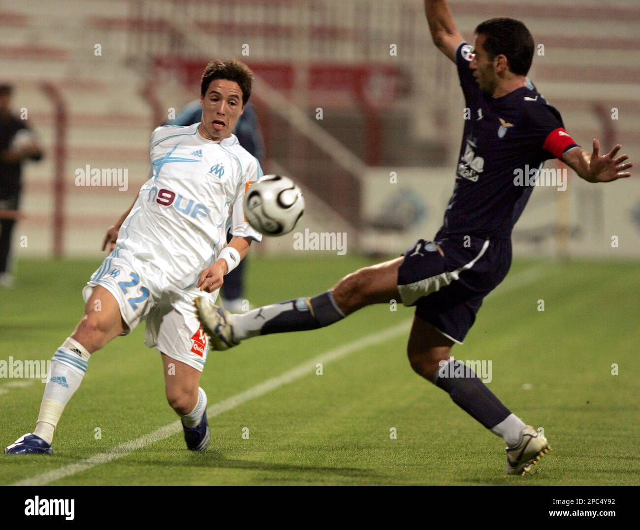 Lazio's Luciano Zauri, right, challenges Marseille's Samir Nasri during ...