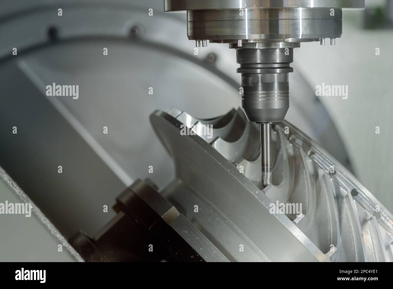 Close up: cnc turning milling machine cutting metal workpiece at ...