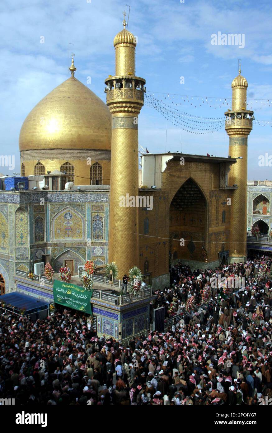 Iraqi Shiites flock to the Imam Ali mosque in Najaf, 160 kilometers ...