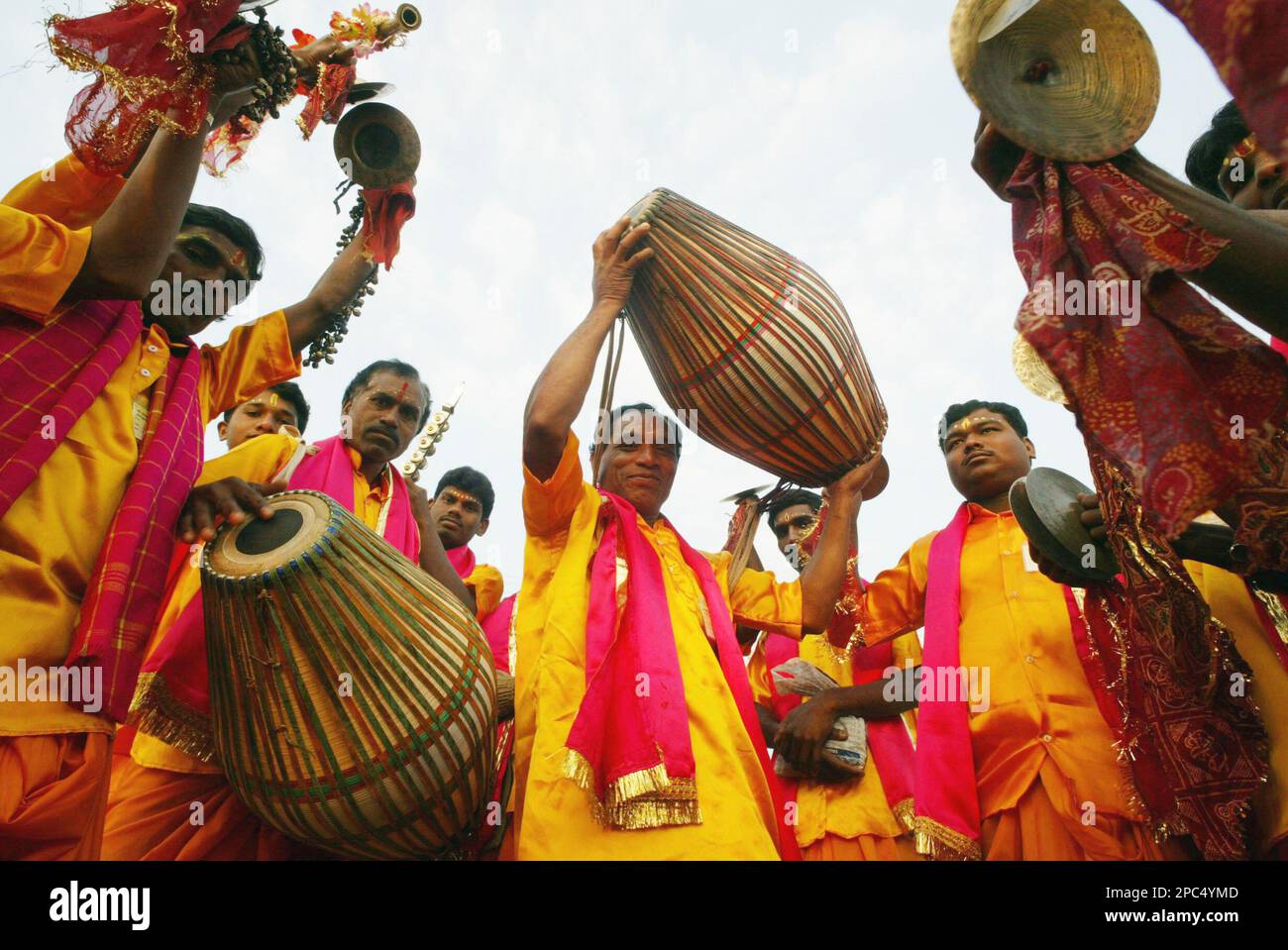 Indian Hindu devotees play musical instruments during a procession in ...