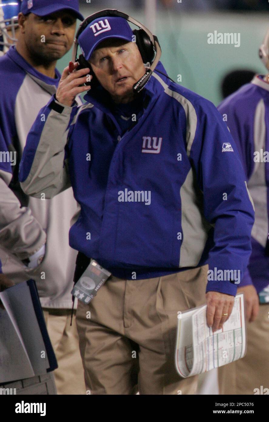 New York Giants head coach Tom Coughlin pulls on his headphones during ...
