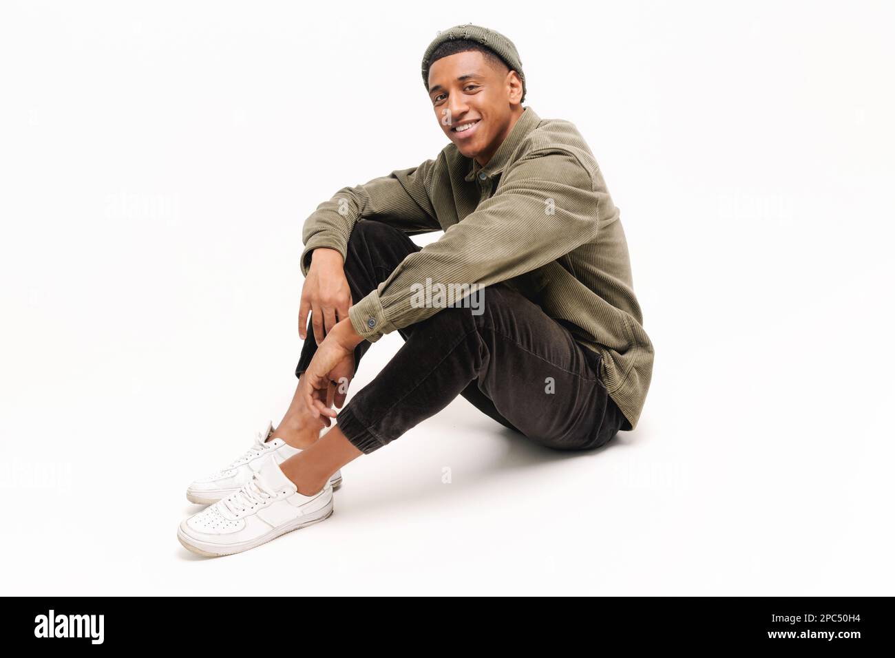 Full length photo of carefree smiling african-american guy in hat ...