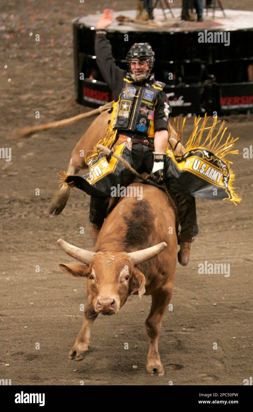 Bull rider Mike Lee, of Decatur, Texas, rides 'Rattler' during the ...