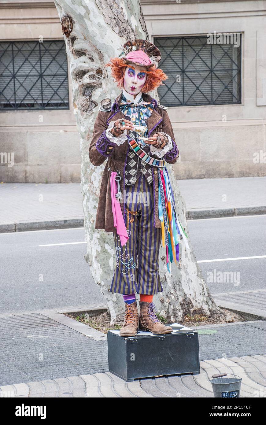 Street performer mime artist in Barcelona playing the role of 'The Mad ...