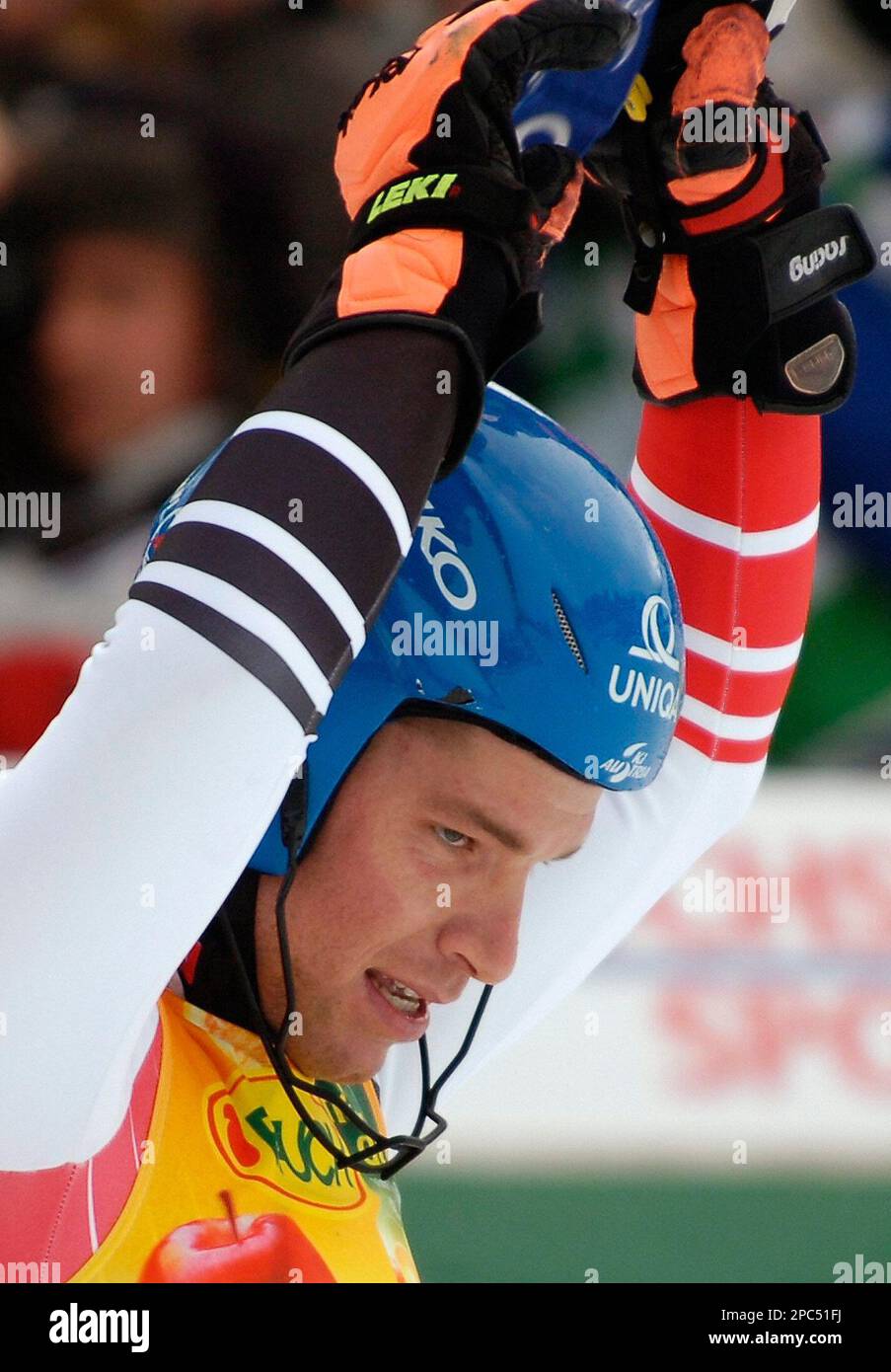Austrian ski racer Benjamin Raich lifts his arms in the finish area of ...