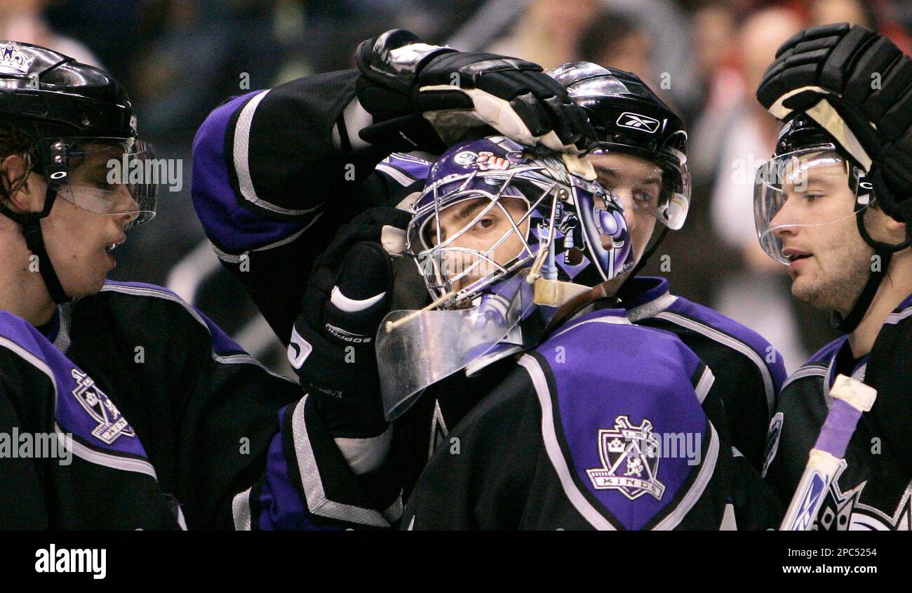 Los Angeles Kings goalie Mathieu Garon, center, is congratulated by ...