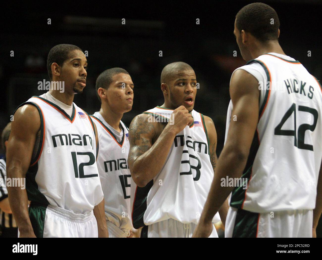 Miami's Anthony Harris (12), Denis Clemente (15), Jack McClinton (33 ...