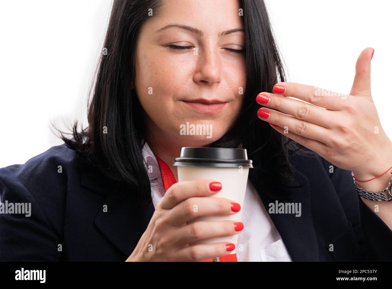 Close-up of adult businesswoman smelling good hot coffee aroma from ...