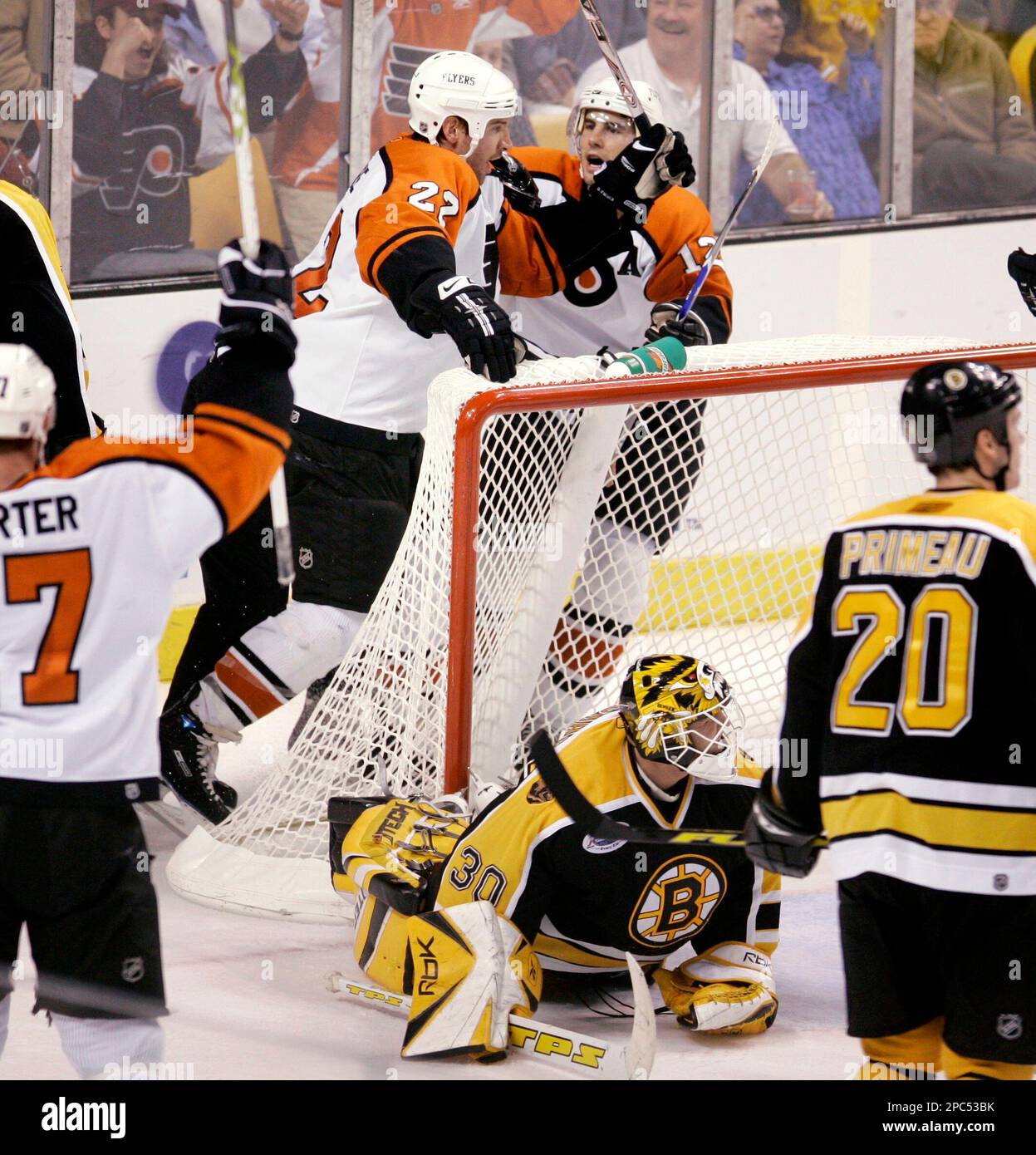 Boston Bruins goalie Tim Thomas (30) lies on the ice as Philadelphia Flyers' Mike Knuble (22 ...