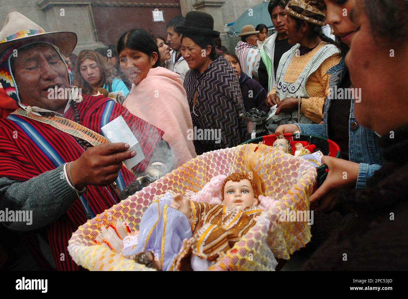 An Aymara shaman performs a traditional purification ritual over an ...