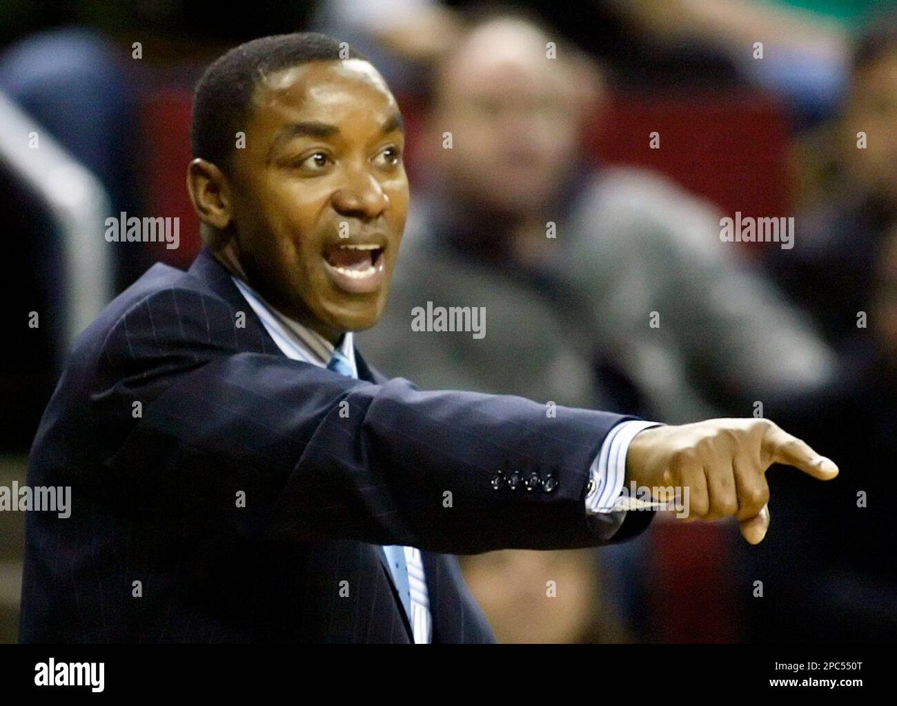 New York Knicks' head coach Isiah Thomas makes a point to his players ...