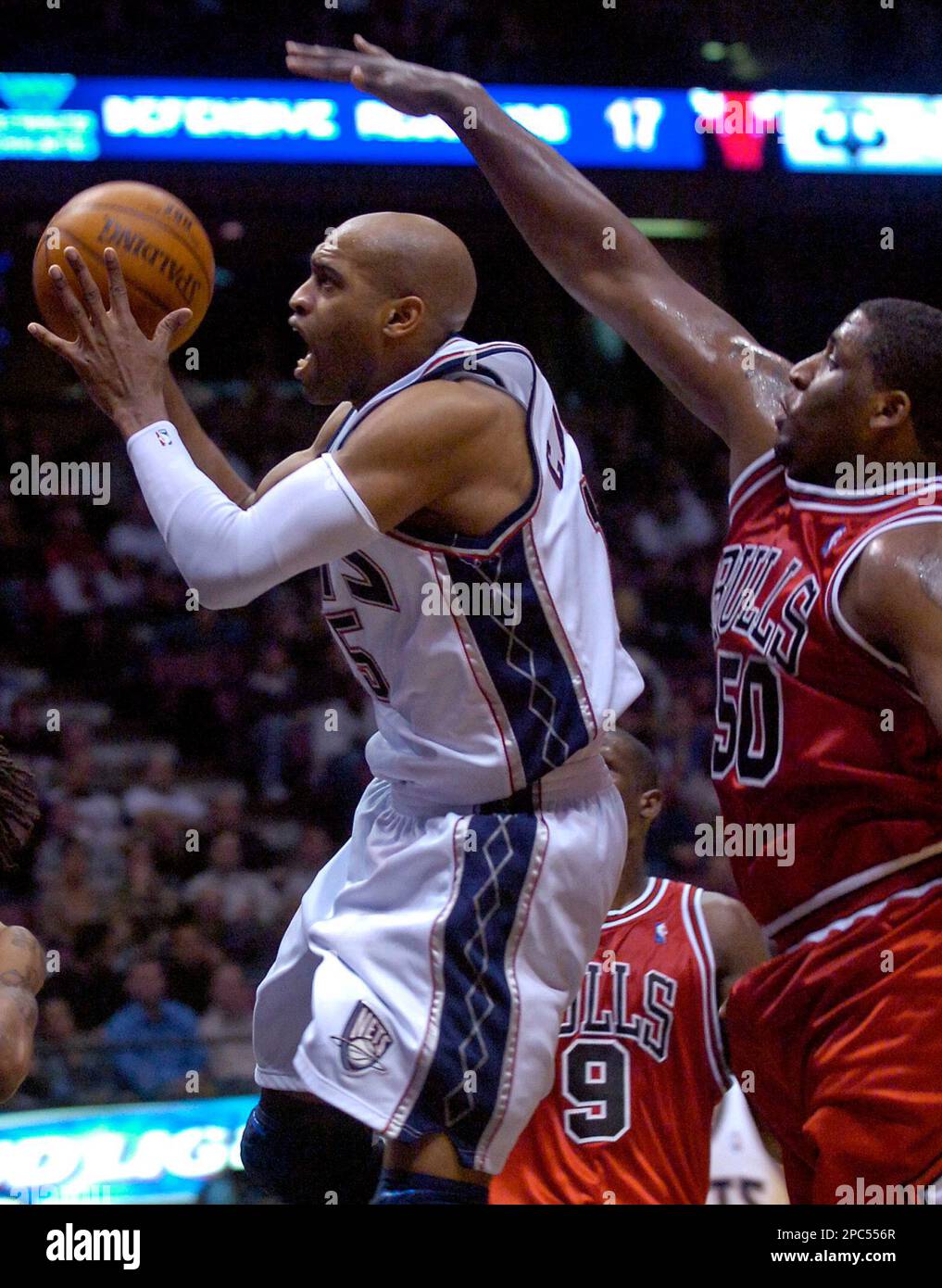 New Jersey Nets' Vince Carter goes up with a shot as he gets by Chicago ...