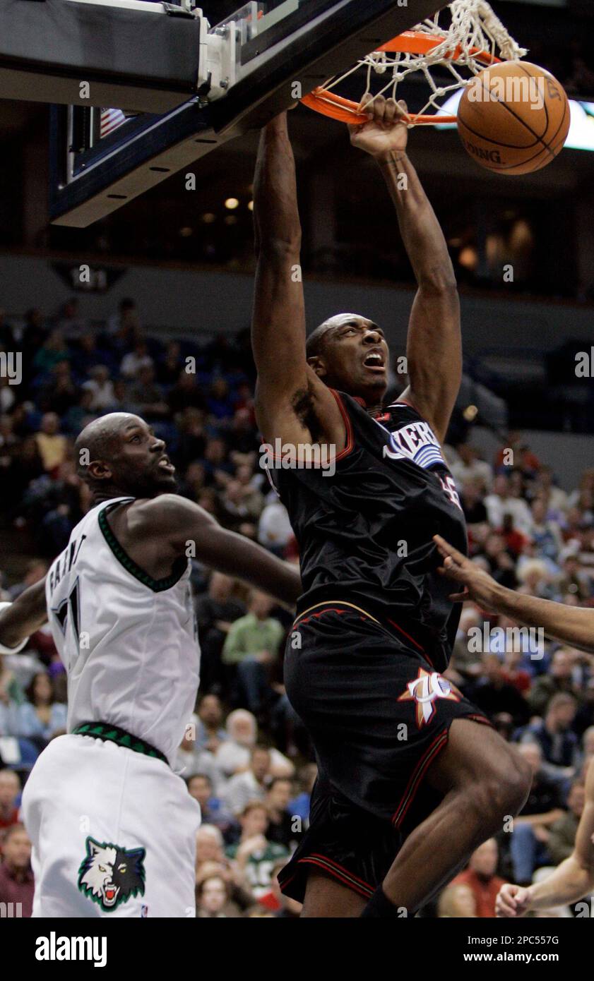 Philadelphia 76ers center Steven Hunter, right, dunks over Minnesota ...
